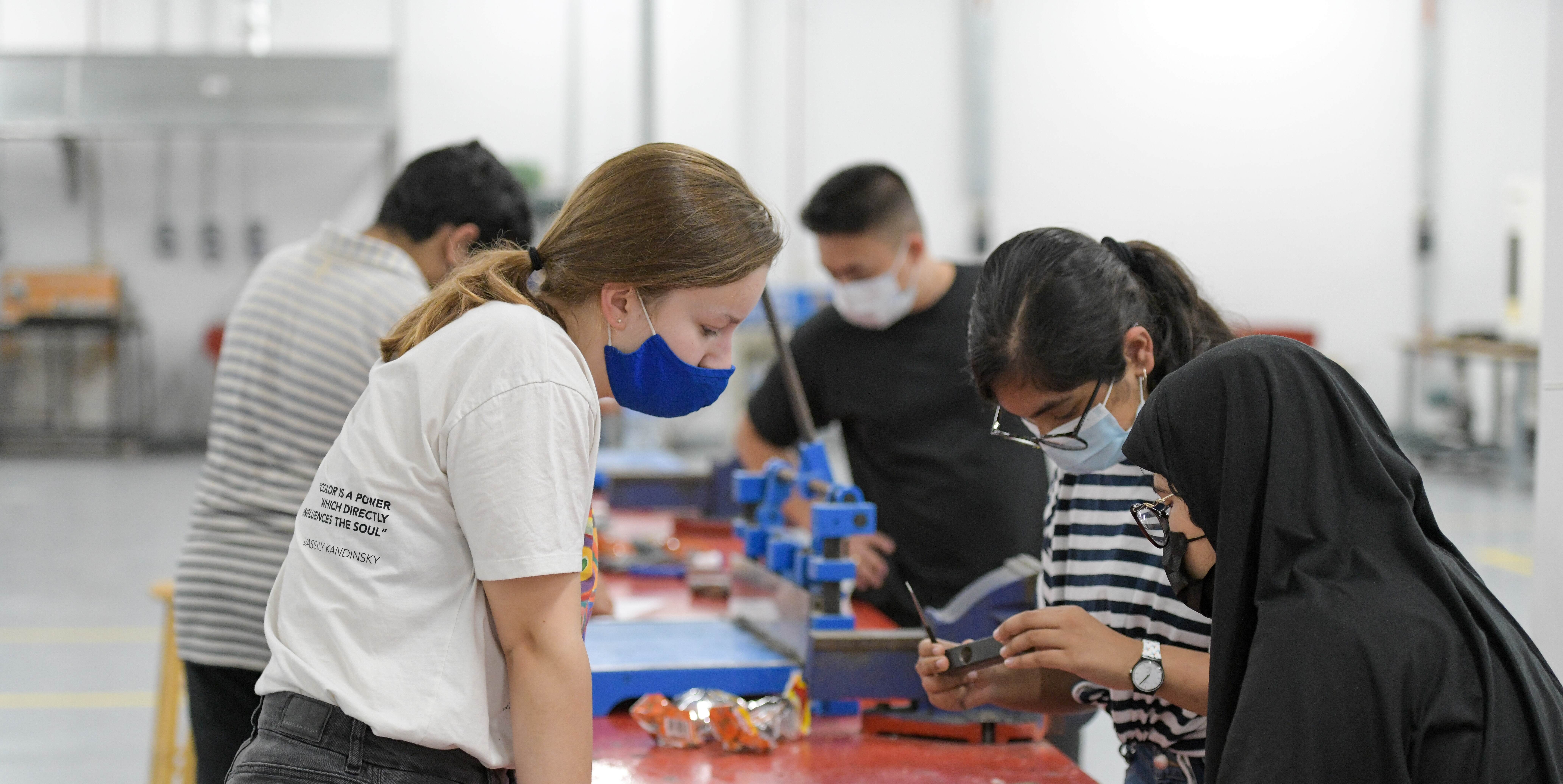 High school students build robots and print quadcopters in AUS ...